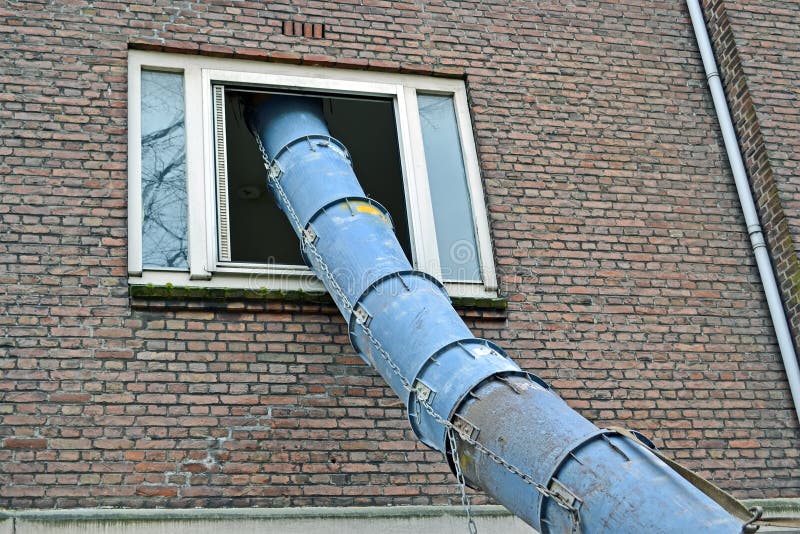 Industrial Brown Pipe Over Yellow Building, Sky, Stock Photo - Image of ...