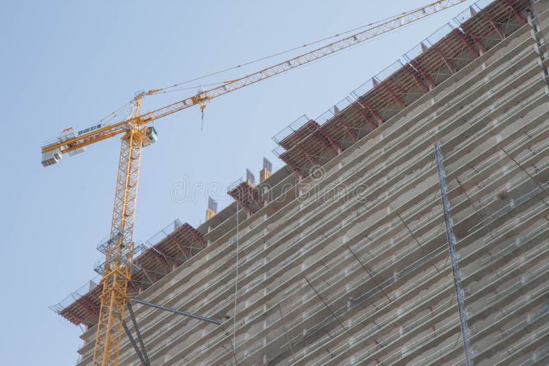 Big Industrial Tower Crane with Unfinished High Raised Building Stock ...