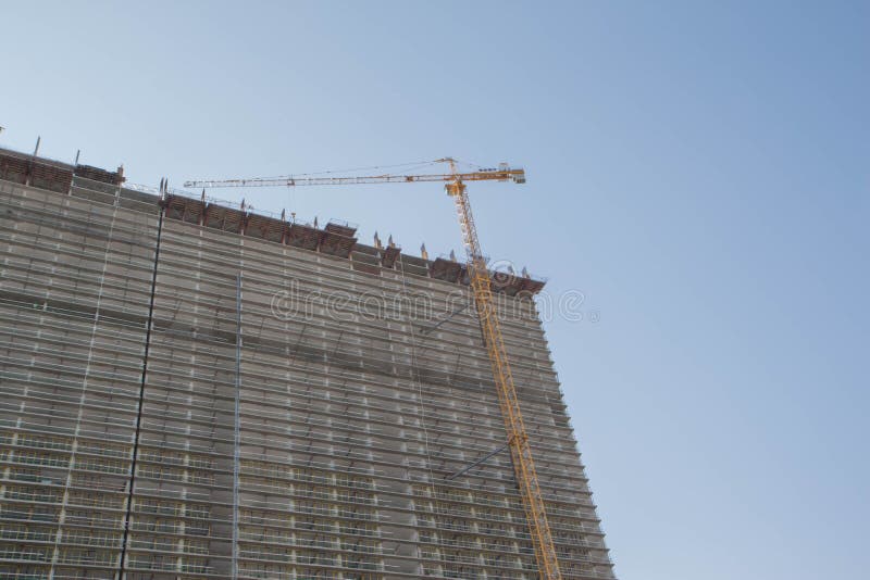 Big Industrial Tower Crane with Unfinished High Raised Building Stock ...