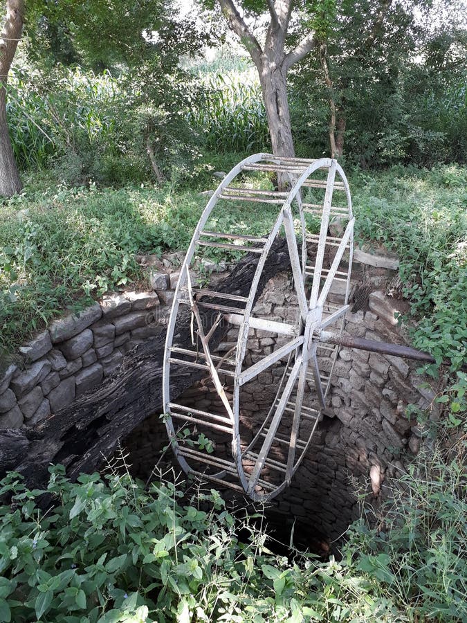 Well wheel stock image. Image of iron, wheel, outdoor - 99569279