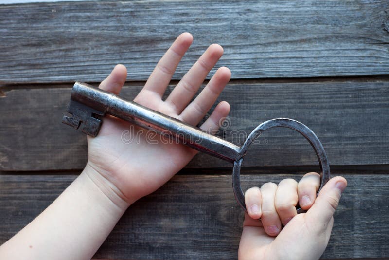 Big key in two hands stock photo. Image of investigator - 50982176