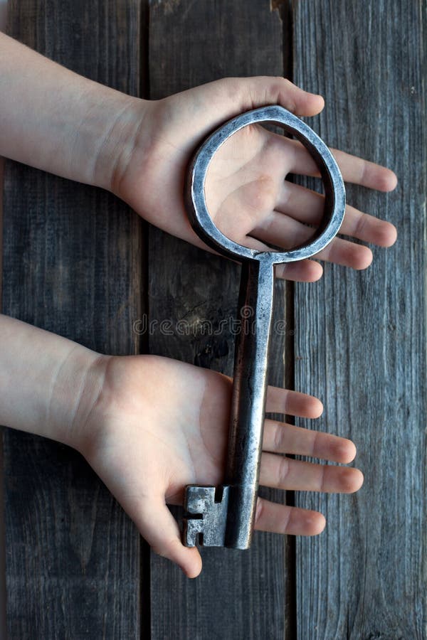 Big key in two hands stock photo. Image of board, code - 50982212
