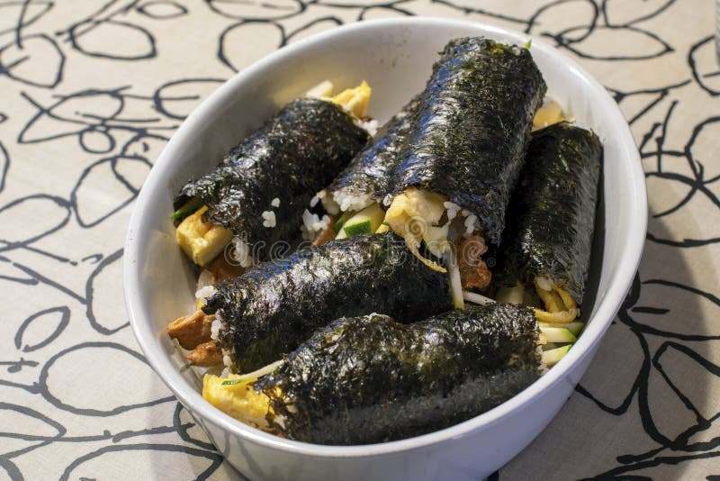 Big kimbap rolls in a bowl stock image. Image of rice - 161108949