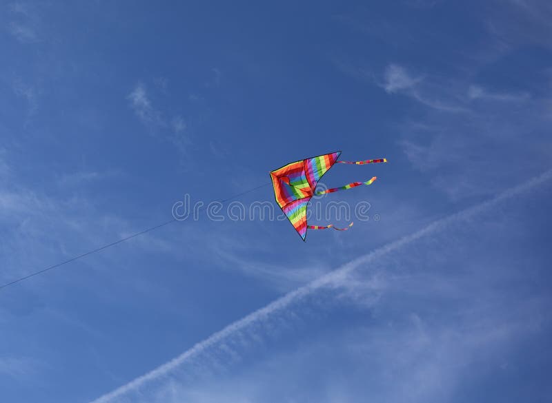 Big Kite with Rainbow Colors Flies Tied on String in the Sky Stock ...