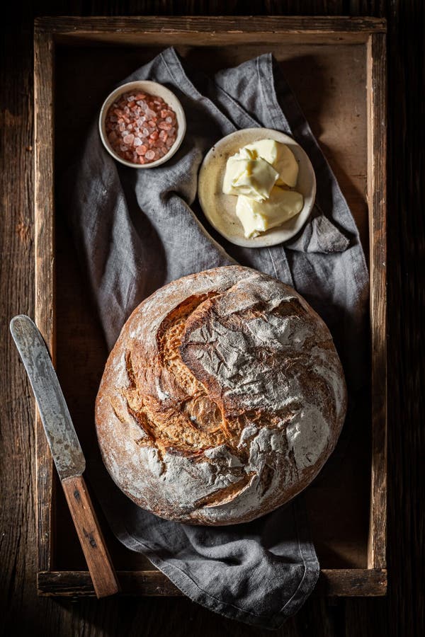 Big Loaf of Bread on Dark on Rustic Wooden Table Stock Image - Image of ...