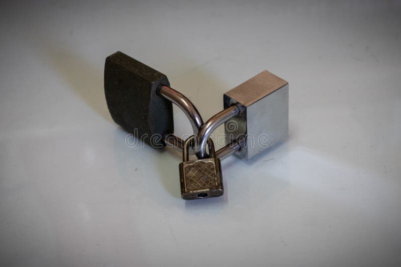 Big Locks Held Together by a Small One Stock Image - Image of security ...