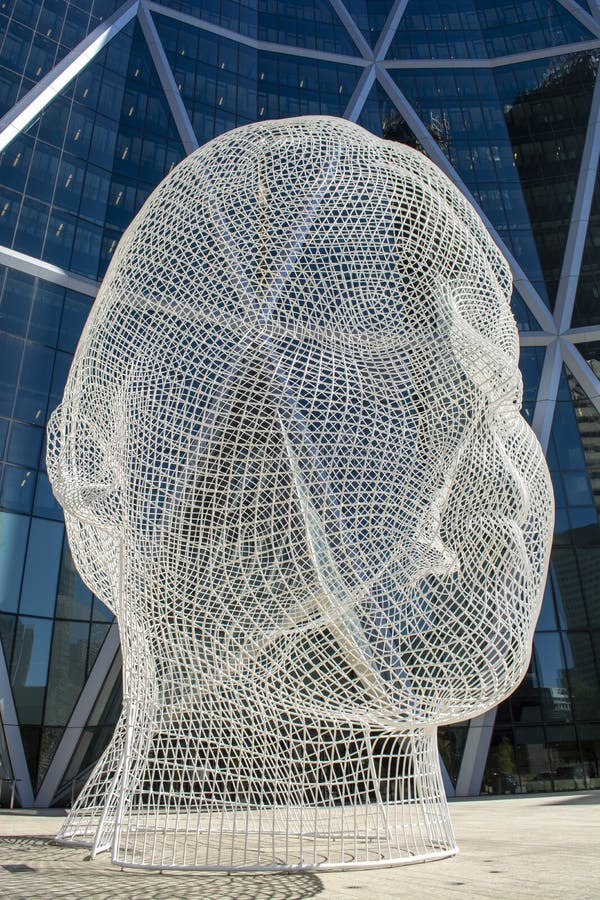 View through Big Mesh Head Public Art Display in Front of Office Tower ...