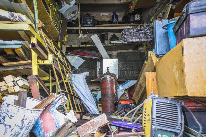 Big Mess in an Over Stuffed Suburban Garage Stock Image - Image of ...