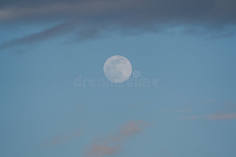 Big Moon with Some Clouds and Blue Sky at the Afternoon Stock Photo ...