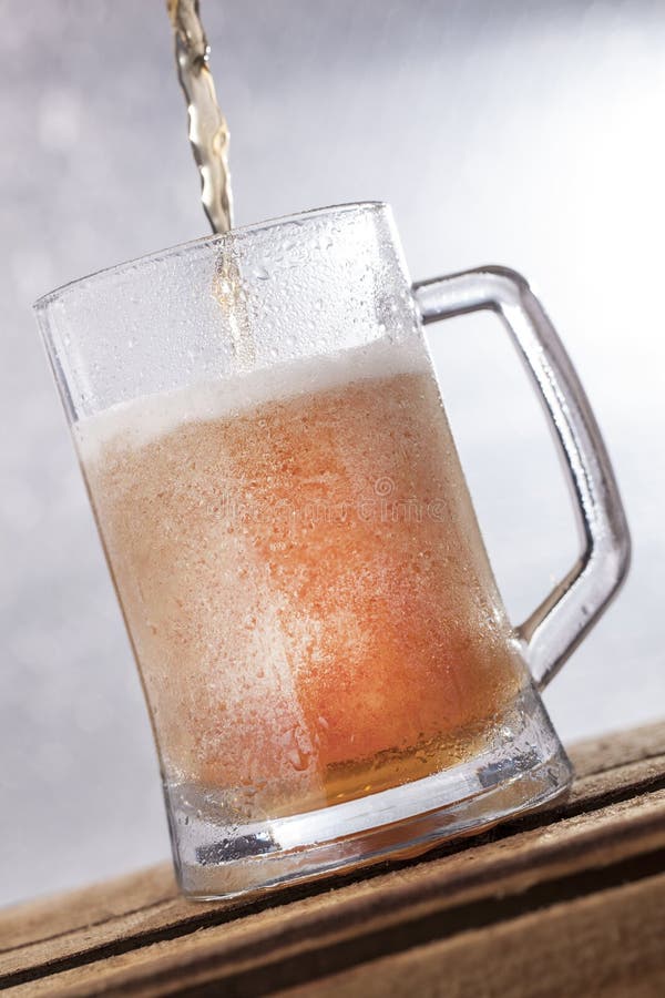 Big mug Beer Over flow stock image. Image of isolated - 156020231