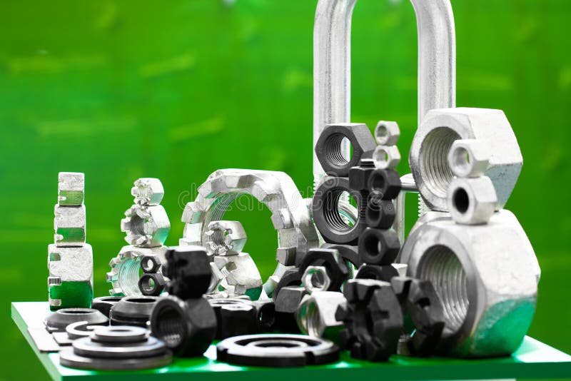 Big Nuts Fasteners Compositions, Green Background Stock Image - Image ...