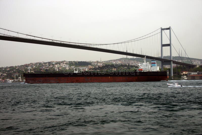 A Big Oil Tanker Passing Under the Bridge in the Bosphorus Stock Photo ...