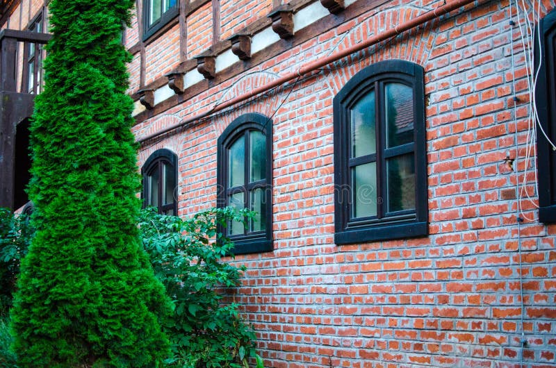 Amazing Old Brick House on the Rock Surrounded by High Brck Wall and a ...