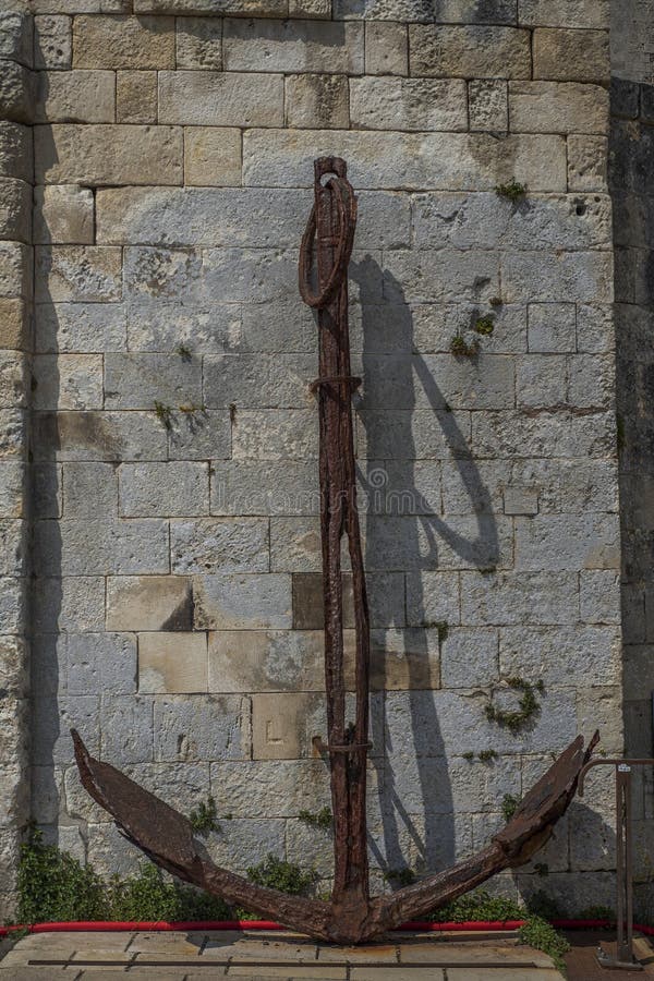 Big old rusted anchor stock photo. Image of iron, france - 318643680