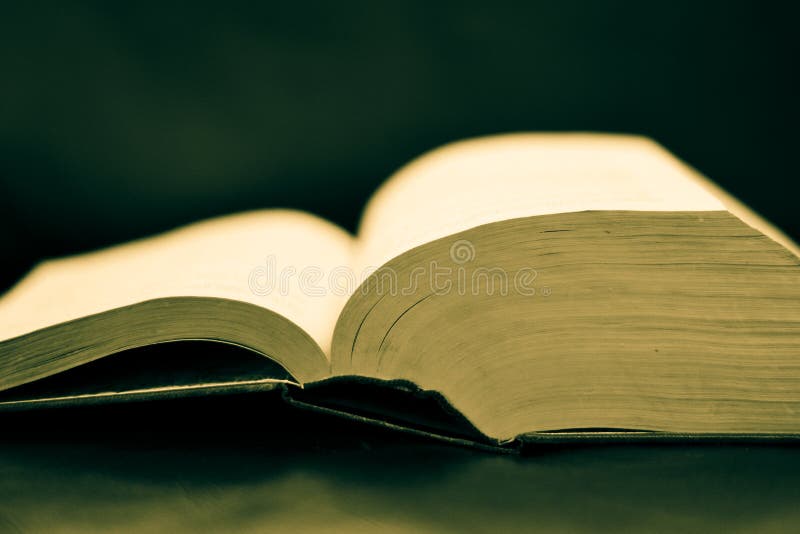 A big open and dusty book stock image. Image of koran - 115505877