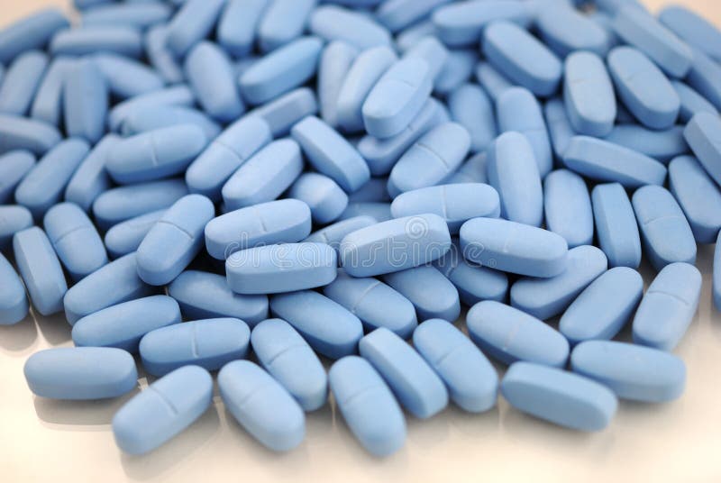 Big Oval Blue Tablets Closeup with Sofl Natural Shadows and Reflection ...