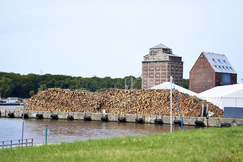 Big Pile of Timber Ready for Loading on Ship in Seaport Stock Photo ...