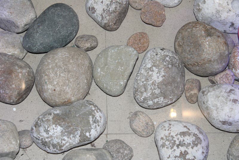 Big Piled Up Rocks on Floor Stock Photo - Image of floor, money: 199198250