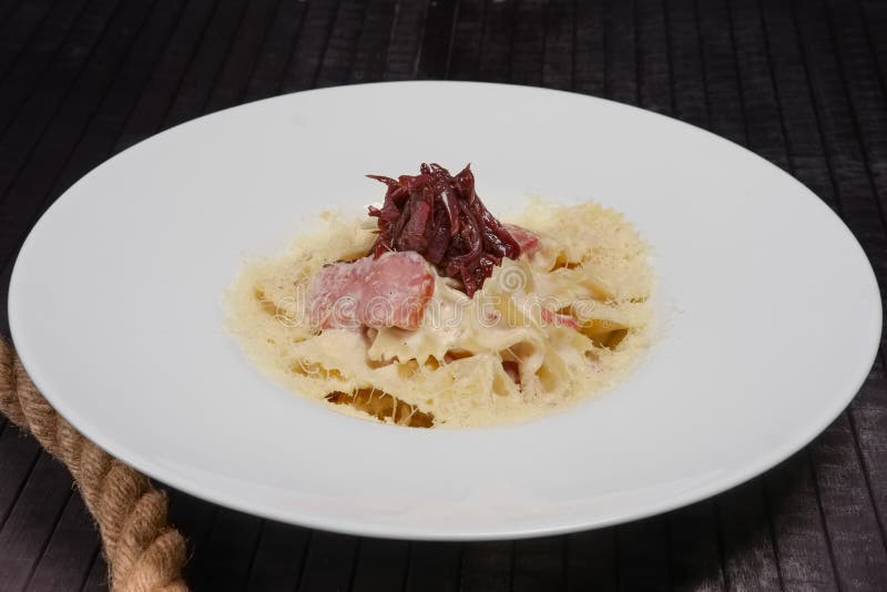 Big Plate of Pasta with Ham, Pickled Onion and Cheese Stock Photo ...