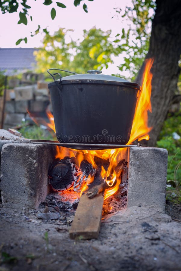 The big pot on the bonfire stock photo. Image of food - 73269320
