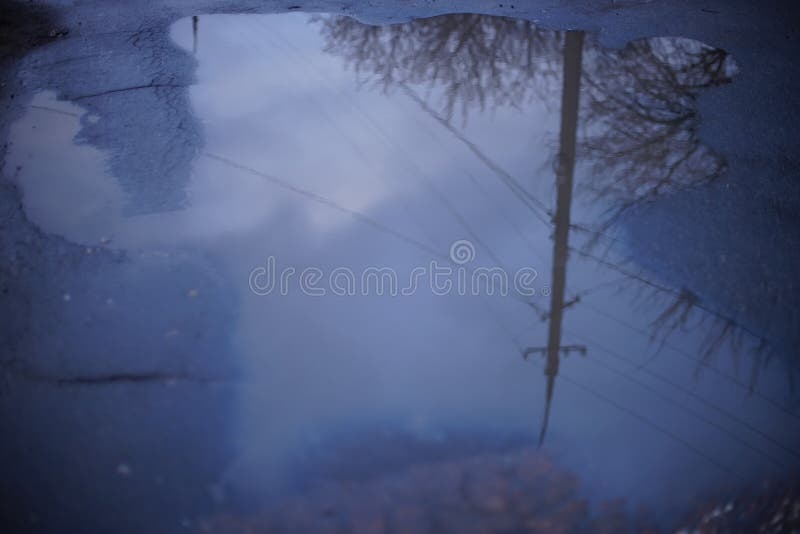 Big Puddle on the Asphalt Road, Reflection in Water with Sky, Bare ...