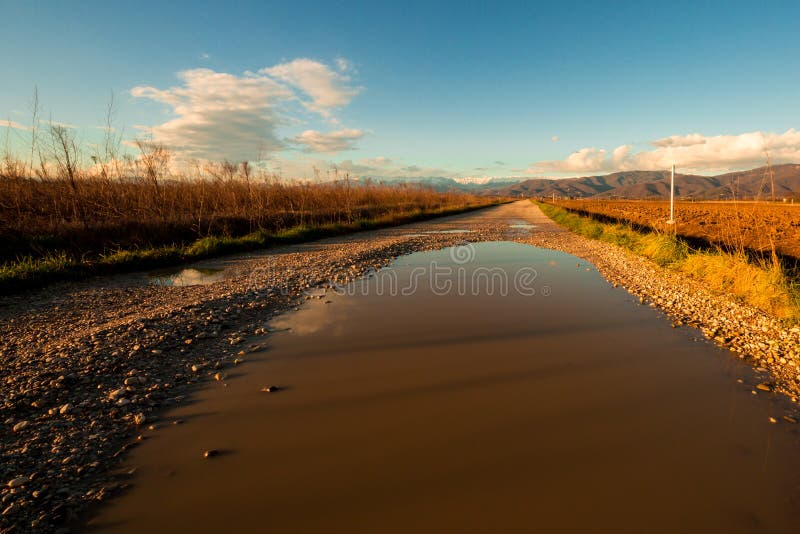 Big puddle in the country stock image. Image of blue - 39517693