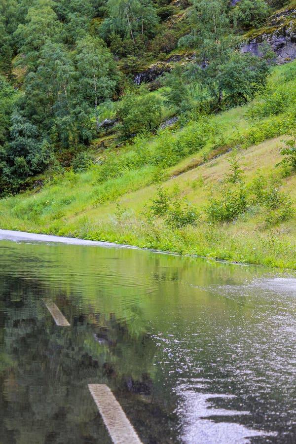 Big Puddle on the Road after Rain. Wet Road Norway Stock Image - Image ...