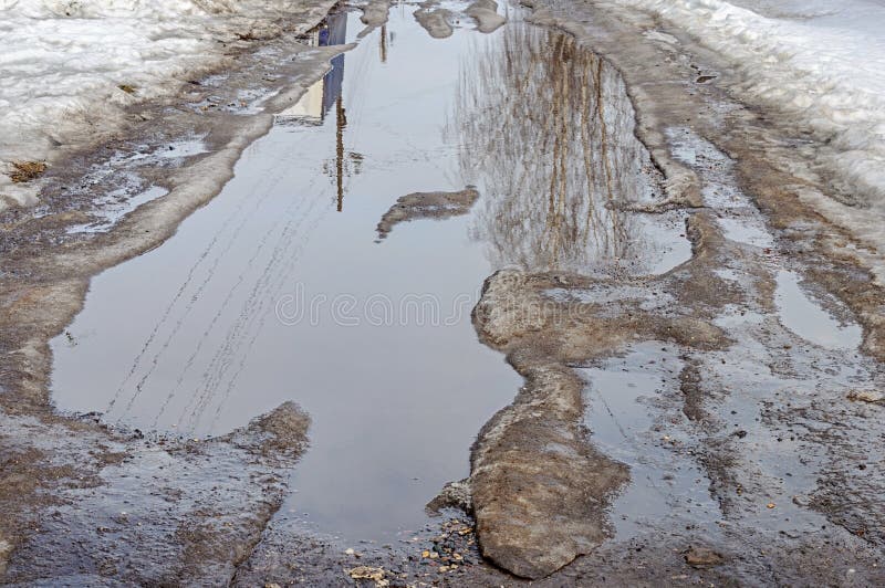 Big Puddle on the Road in Spring Stock Image - Image of outdoor, early ...