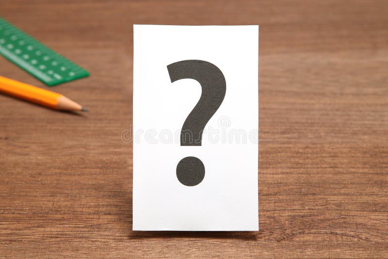 Big Question Mark on White Paper, and Stationery As the Background ...
