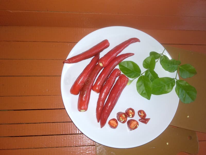 Big red chilli stock image. Image of leaf, green, plate - 179352281