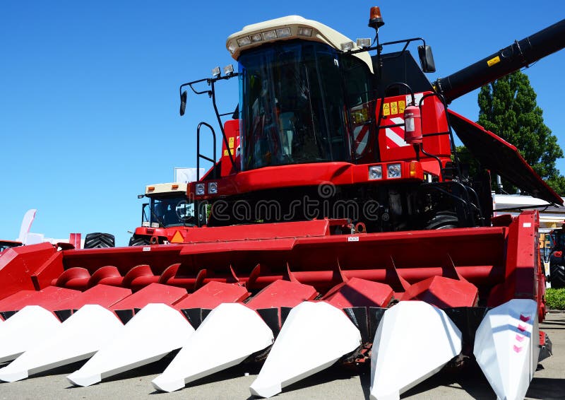 Big Red Combine Harvester Against Blue Sky Stock Photo - Image of ...