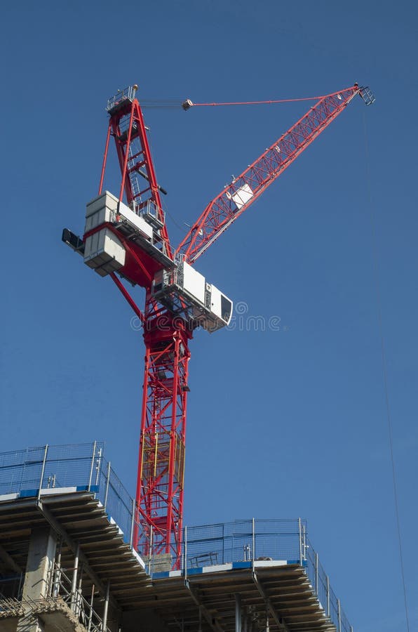 Big Red Crane and Newly Built Skyscraper in the Sky Stock Photo - Image ...