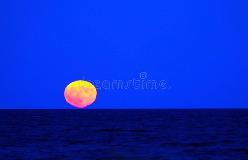 Full Red Moon on Fire with Reflection on the Sea in the Evening Stock ...
