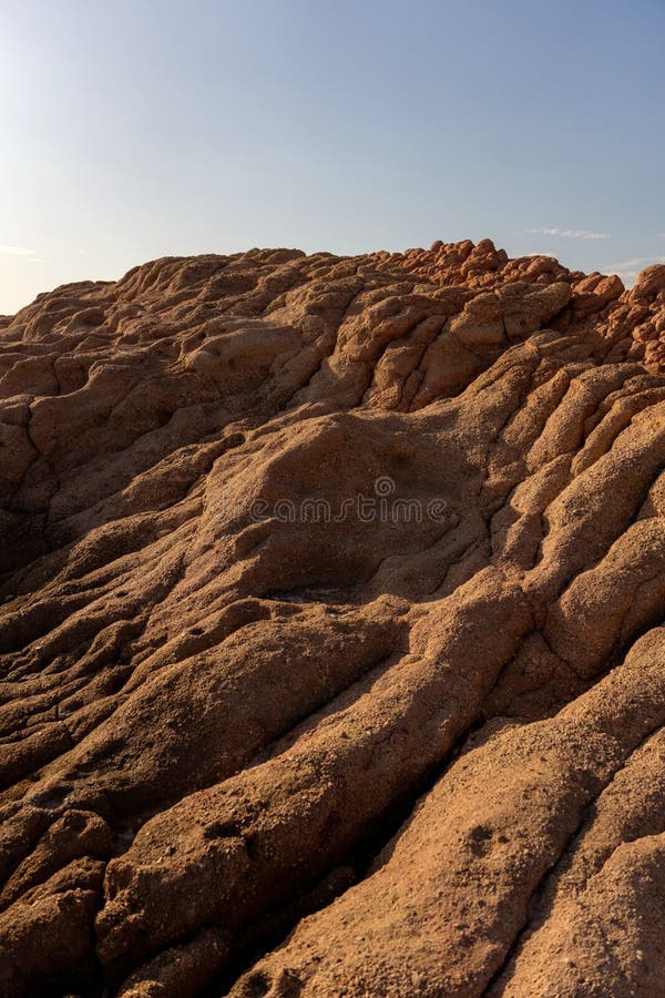 Big red rocks by the beach stock photo. Image of rocky - 261902392