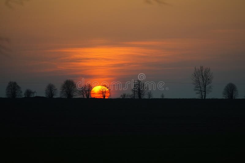 Big red sun on the horizon stock image. Image of illuminated - 366995193