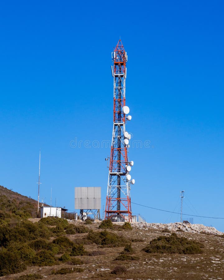Big Red and White Antenna Tower on Top of the Mountain Stock Image ...