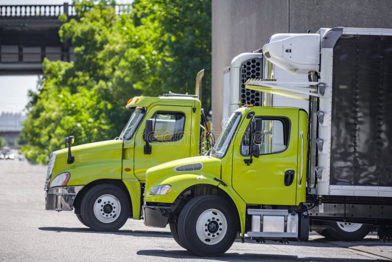 Big Rig Day Cab Semi Trucks Standing in Row at Warehouse Dock Gates for ...