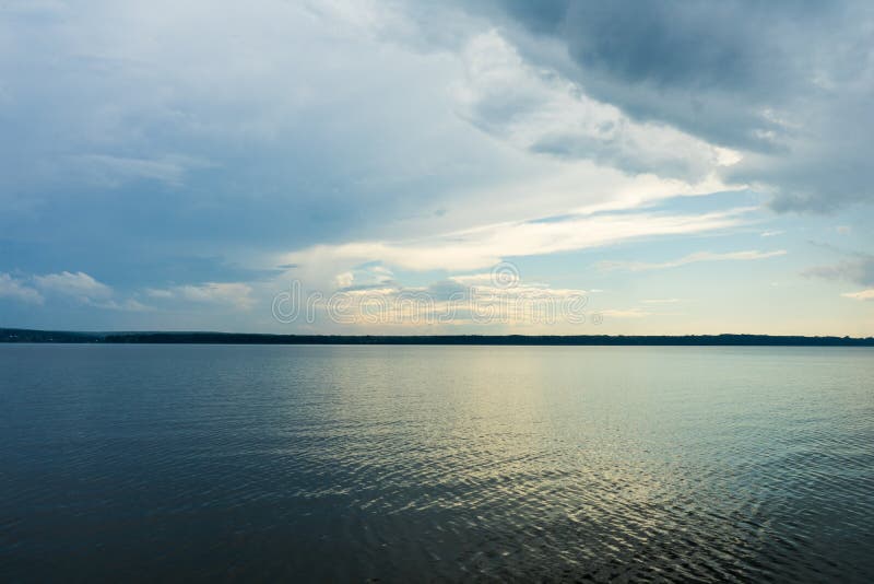 A Big River Flows Under Big Clouds. Stock Photo - Image of beautiful ...