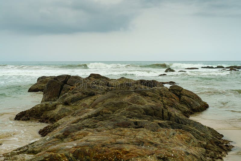 A Big Rock on the Sand on the Ocean Beach Stock Photo - Image of ...