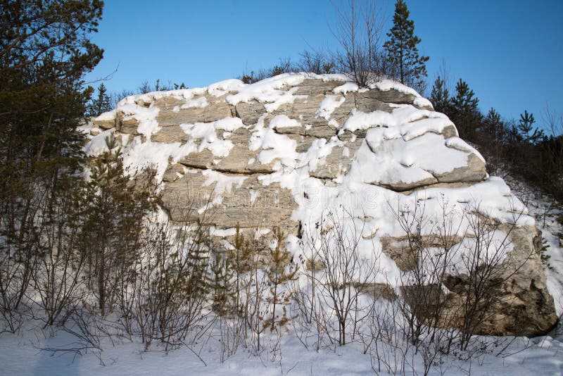 Big Rock in Snowy Forest at Sunny Winter Day. Snowy Rock in Forest ...
