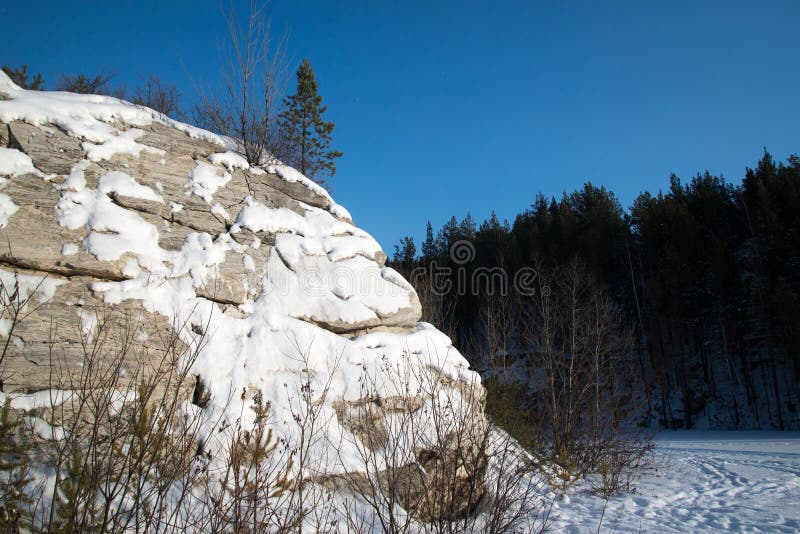 Big Rock in Snowy Forest at Sunny Winter Day. Snowy Rock in Forest ...