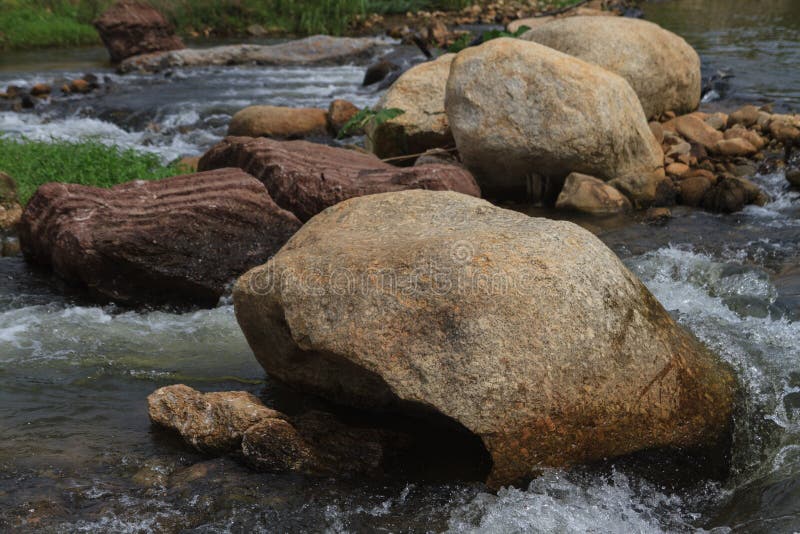 Big rocks in a rapid river stock image. Image of natural - 75359833