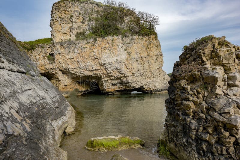 Big rocks in the sea stock photo. Image of cloud, climate - 148092146