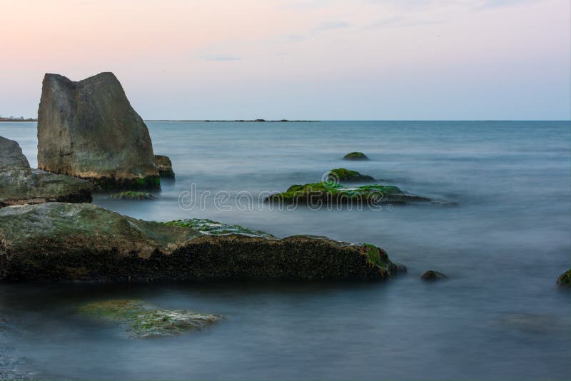 Big rocks on seashore stock photo. Image of italy, moonrise - 60038674