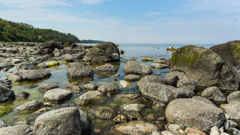 Big rocks at the shore stock photo. Image of rock, rocks - 141987108