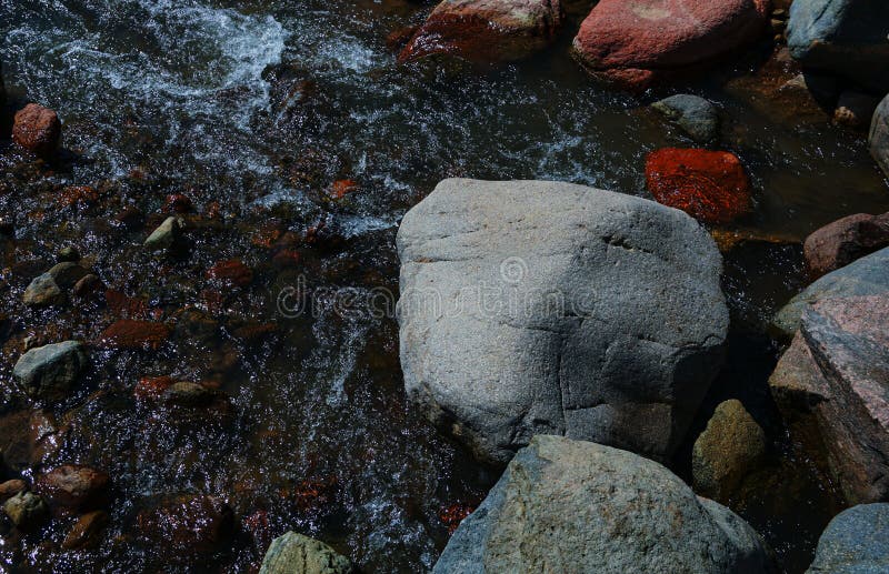 Big rocks in the water stock photo. Image of foam, storm - 255502638