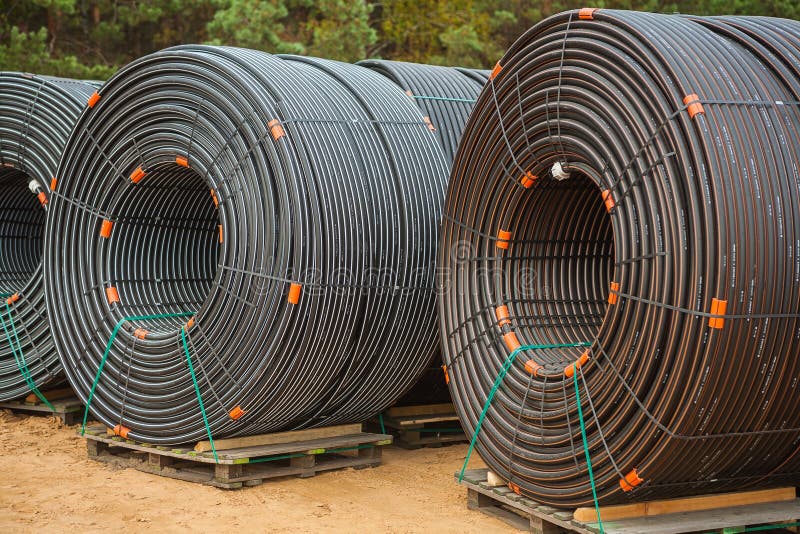 Big Rolls of Pipes on Construction Site in Forest Stock Photo - Image ...