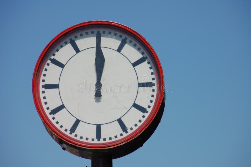 Big Round Red And White Clock. Picture Image: 1065381