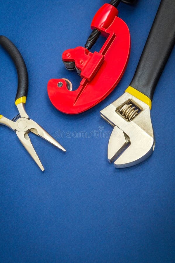 Big Set of Tools and Red Pipe Cutter on Blue Background Prepared by the ...