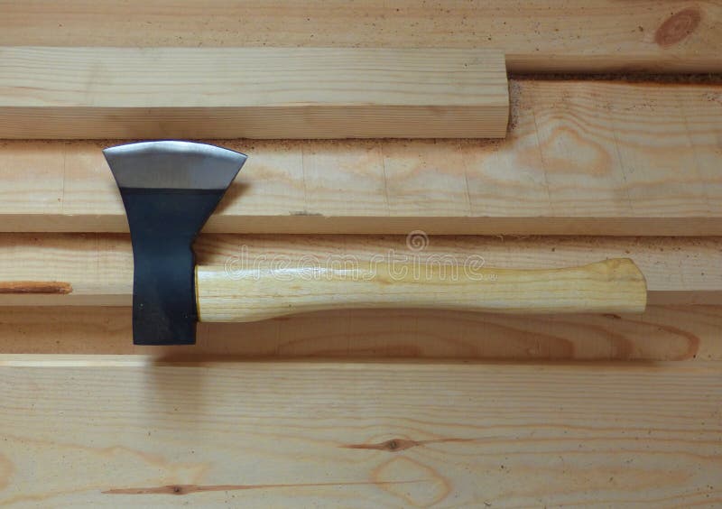 Big Sharp Ax with Black Blade and Light Yellow Handle on Fresh Wooden ...